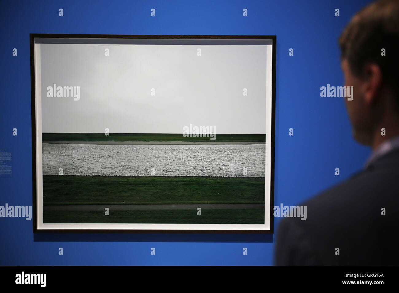 Bonn, Germany. 07th Sep, 2016. A man looks at the photograph 'The Rhine ...