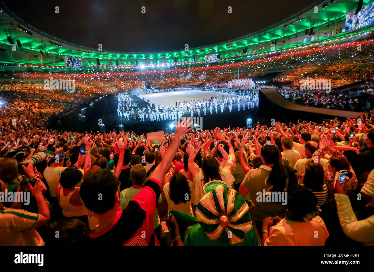 Spectators cheer for Brazilian team at the Maracana Stadium during the ...