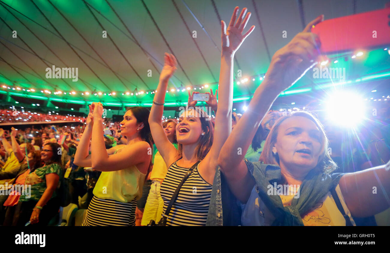 Spectators cheer for Brazilian team at the Maracana Stadium during the ...