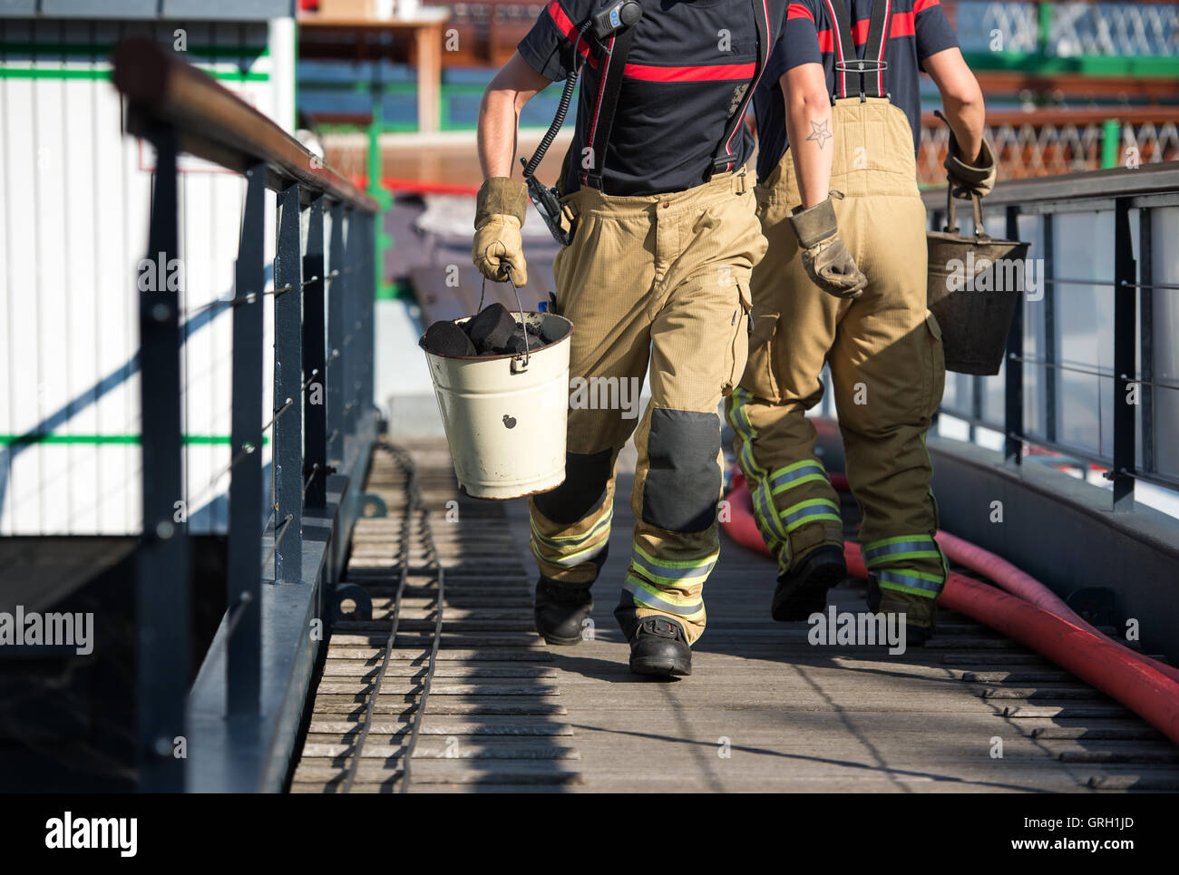 Fire fighters carrying coal off the steamboat 'Diesbar' in Dresden, Germany, 8 September 2016. A ...