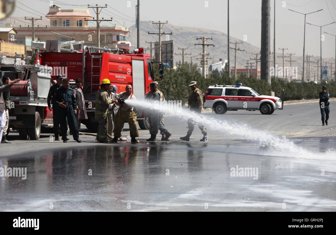 Kabul, Afghanistan. 8th Sep, 2016. Firefighters wash the road after a ...