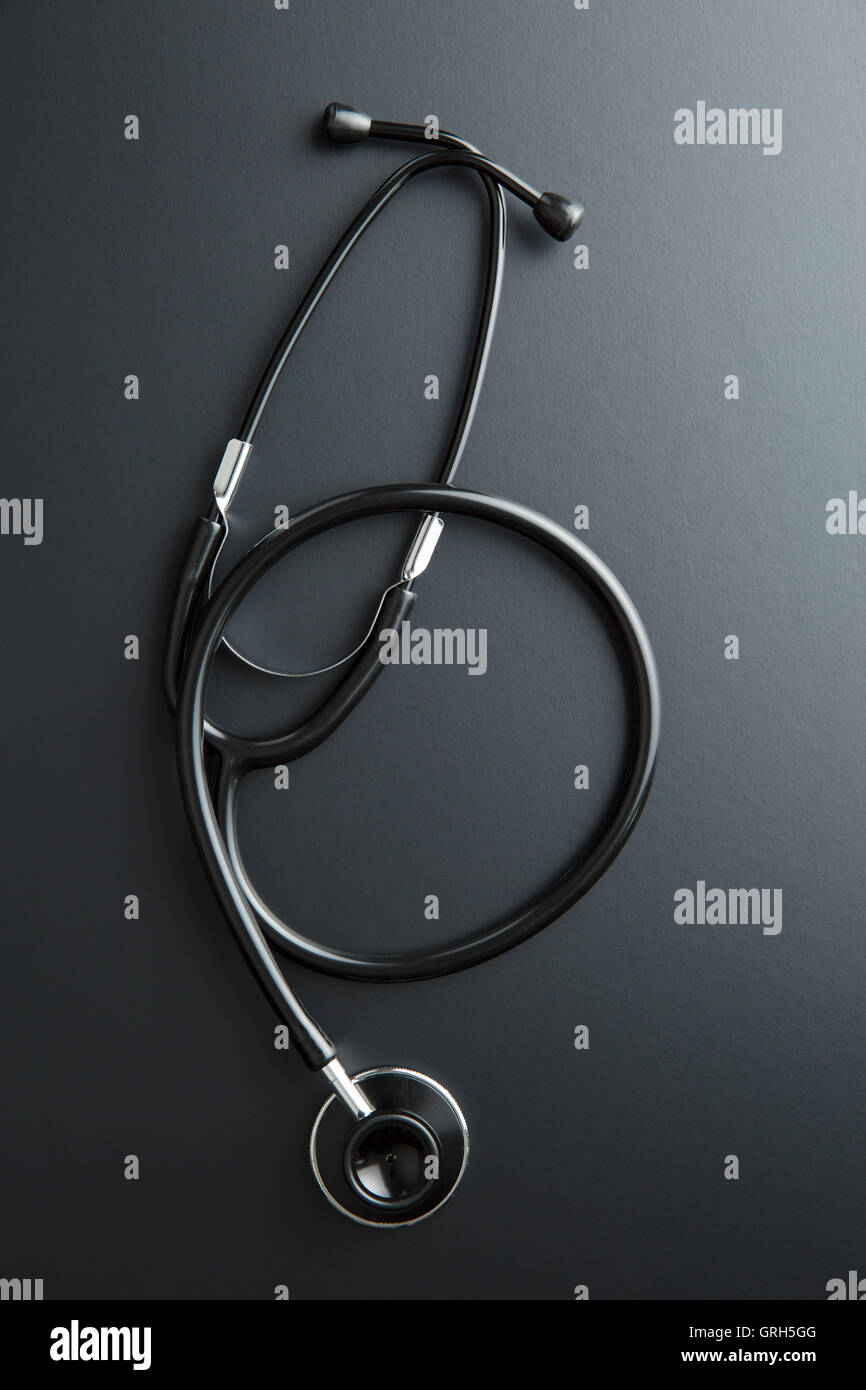 Stethoscope on black table. Top view Stock Photo - Alamy