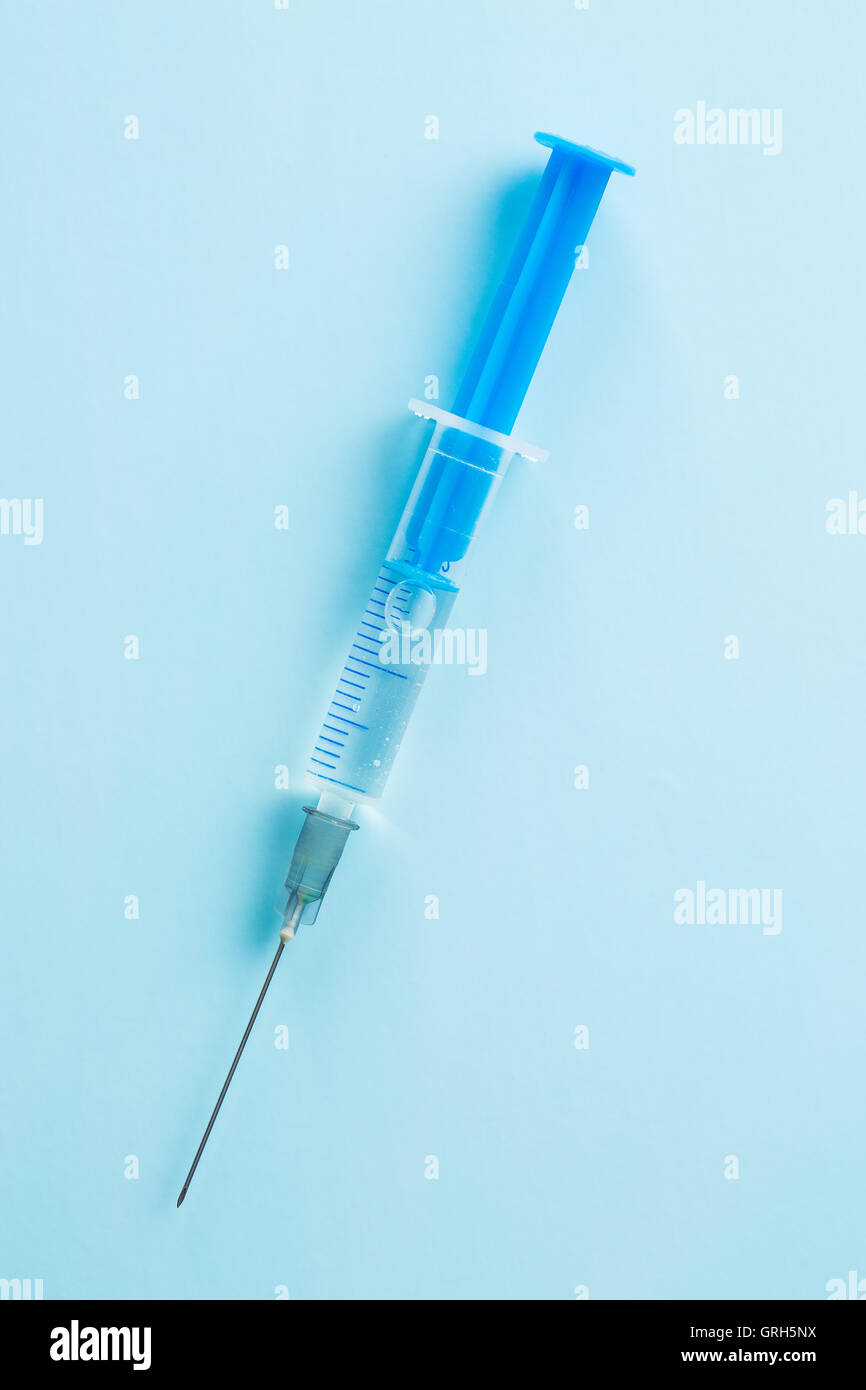 Injection needle blue background hi-res stock photography and images ...