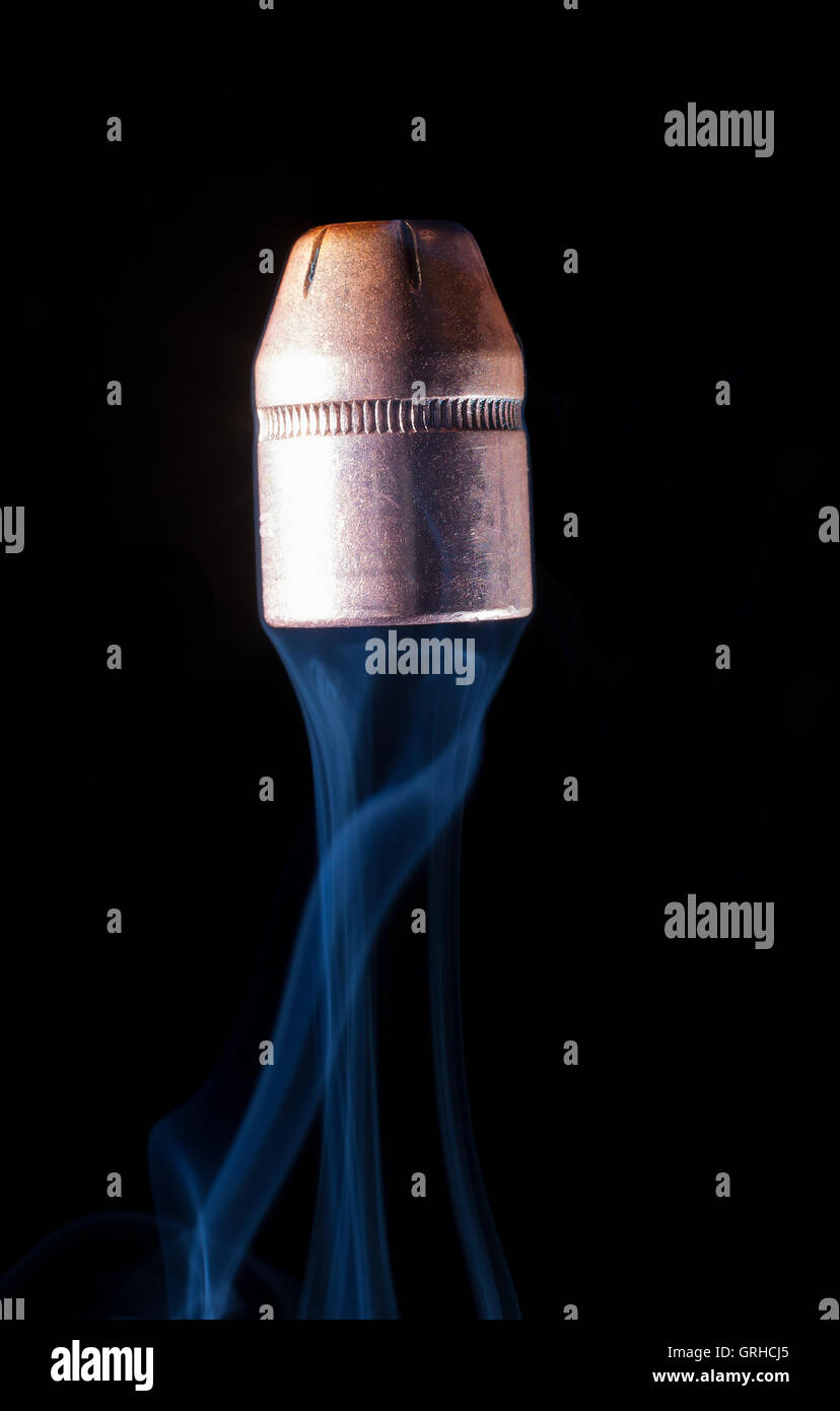 Copper handgun bullet that looks like it is going up Stock Photo - Alamy