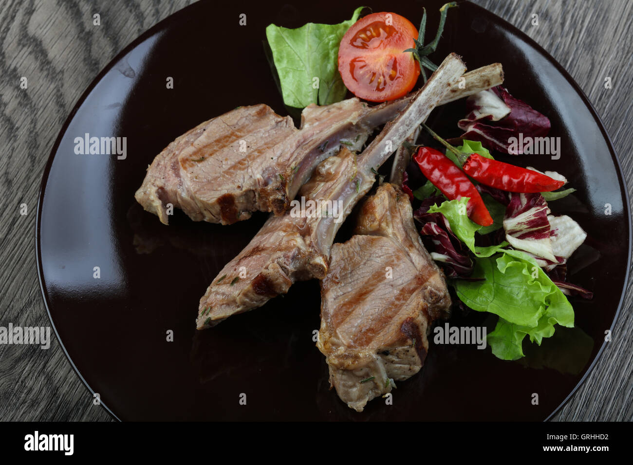 Lamb Frenched Rack grilled rib bone Stock Photo - Alamy