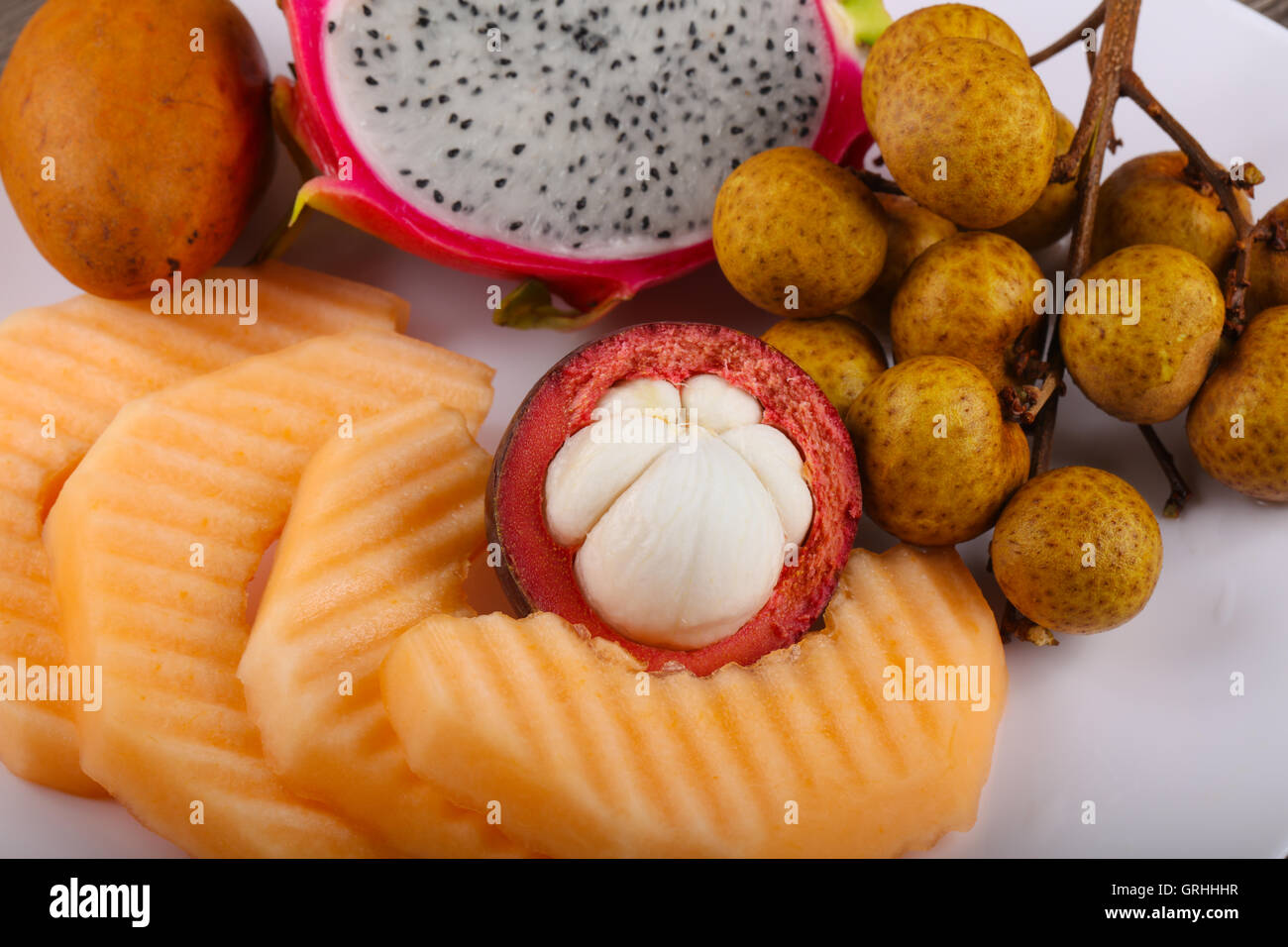 Tropical fruit mix - melon, longan, mangosteen, dragonfruit Stock Photo ...