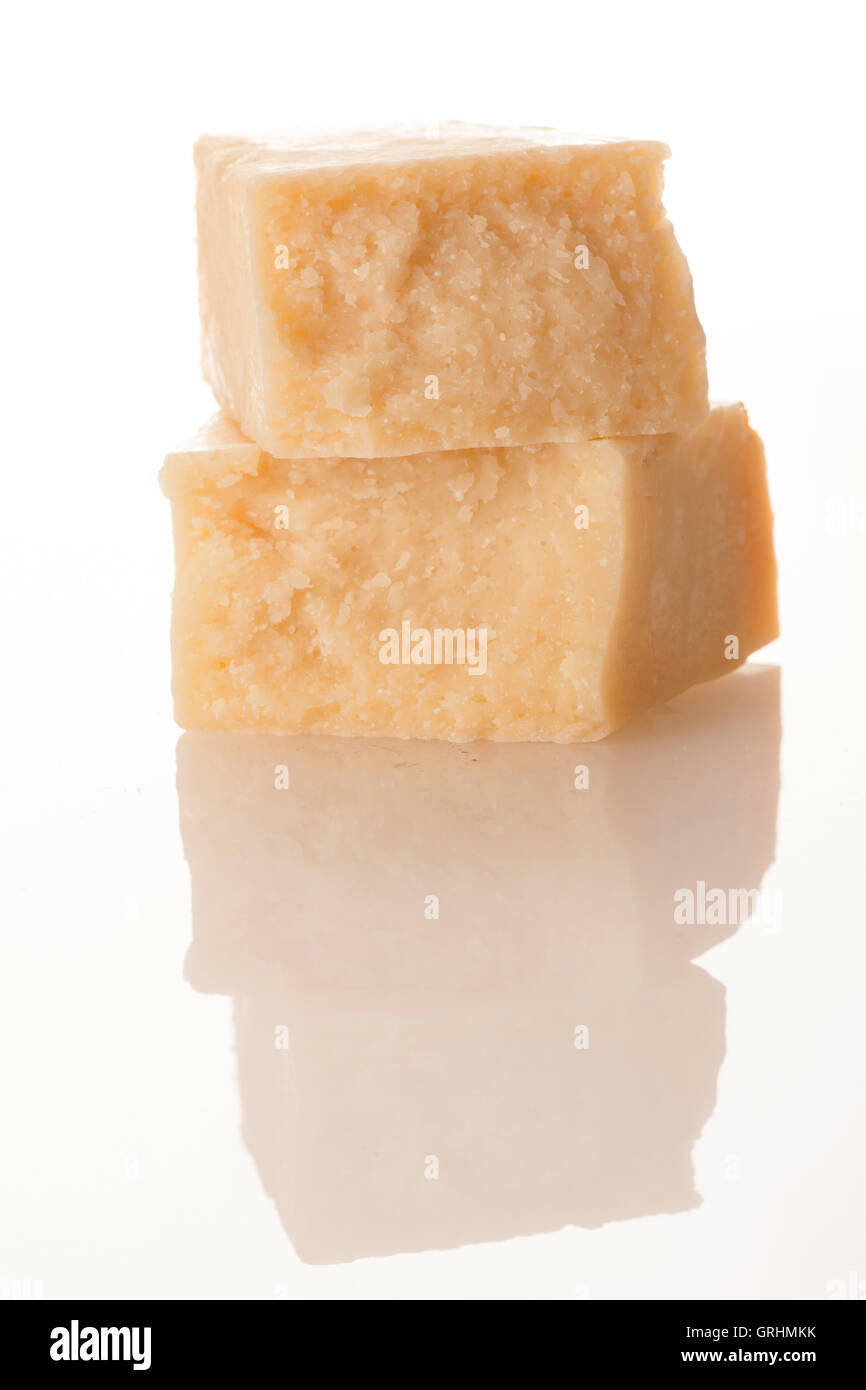 Parmesan cheese isolated over white background Stock Photo - Alamy