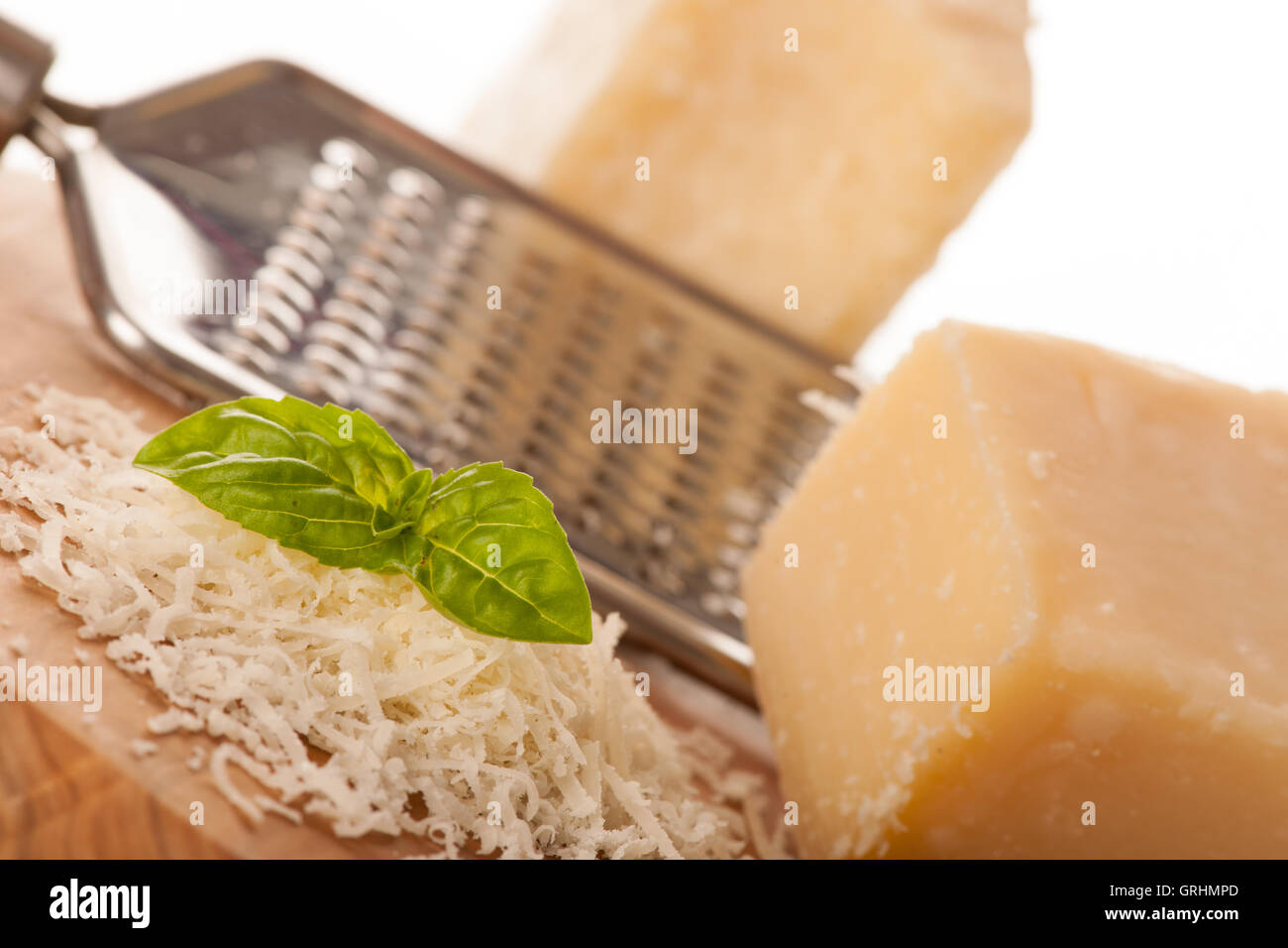 Parmesan cheese isolated over white background Stock Photo - Alamy
