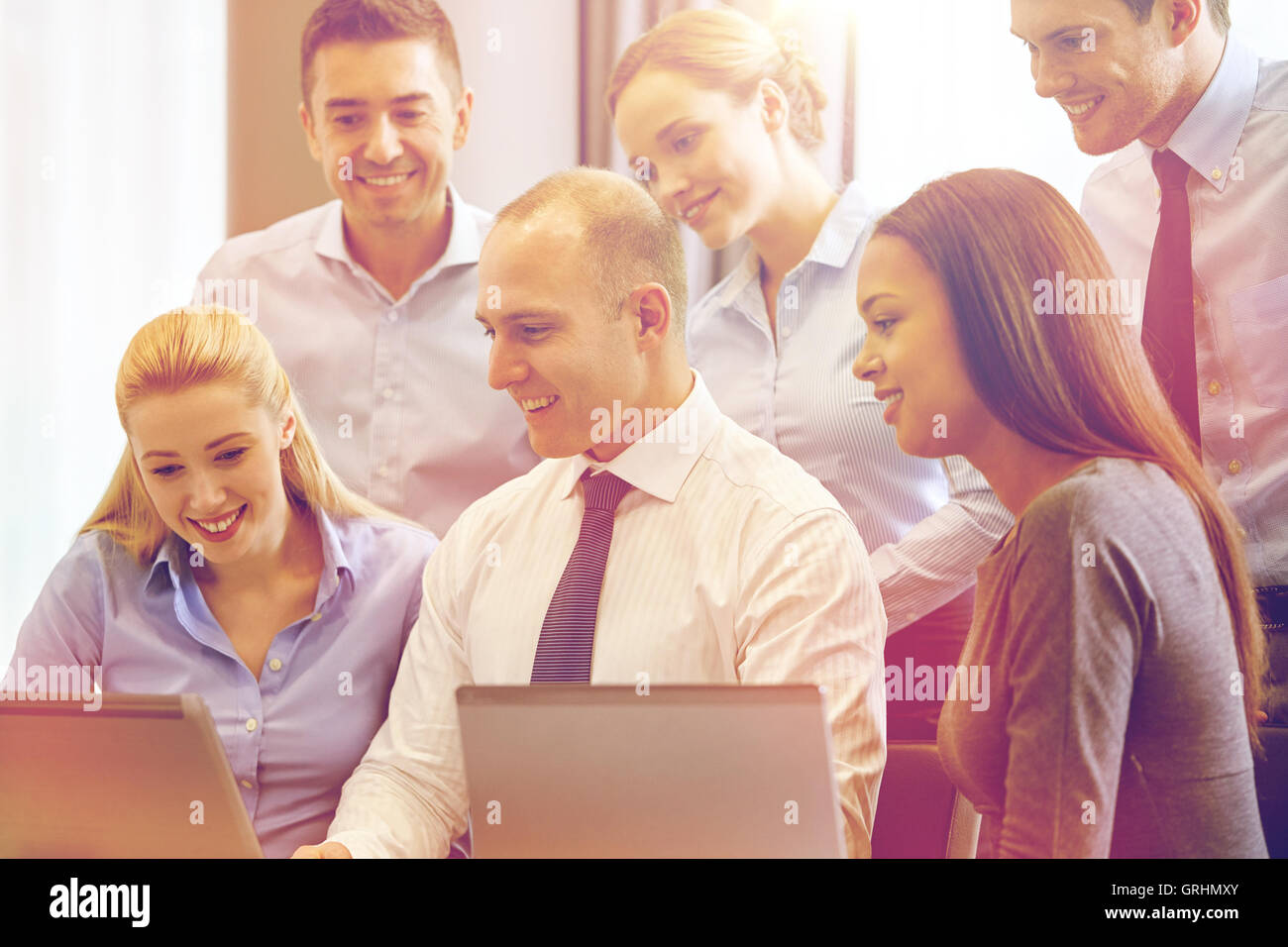 Businesswomen men looking laptop hi-res stock photography and images ...