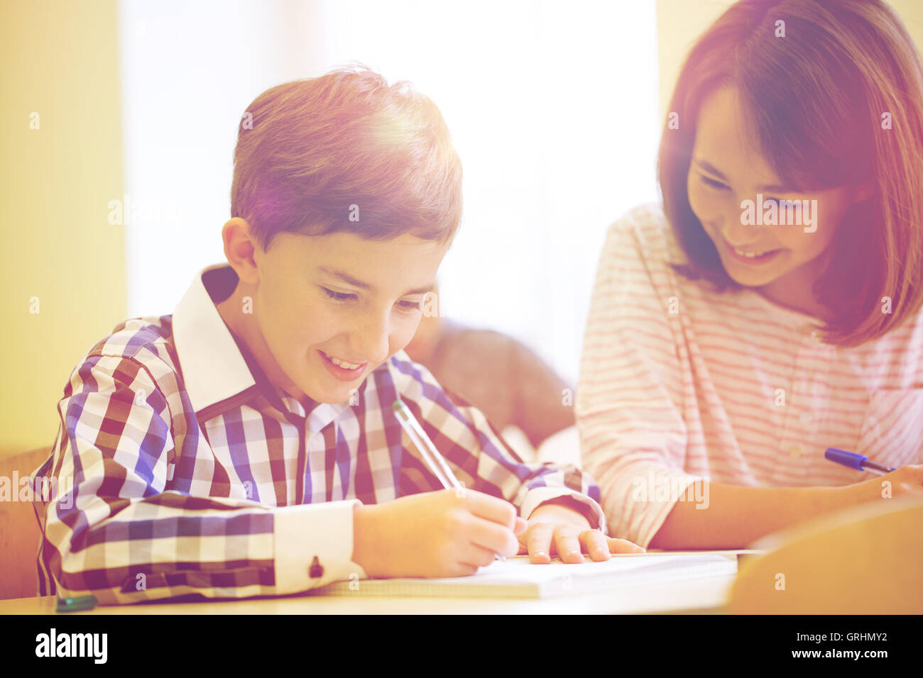 group of school kids writing test in classroom Stock Photo - Alamy