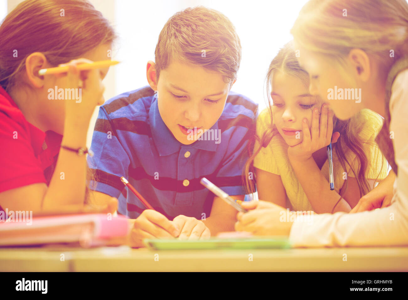 group of students talking and writing at school Stock Photo - Alamy