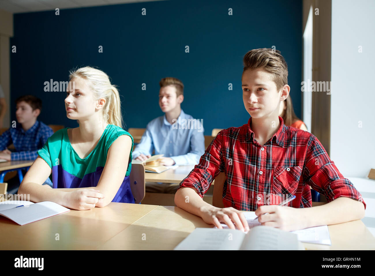 group of students with books at school lesson Stock Photo - Alamy