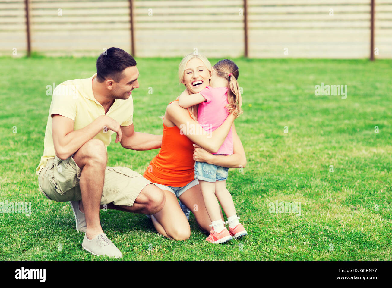 happy family hugging outdoors Stock Photo - Alamy