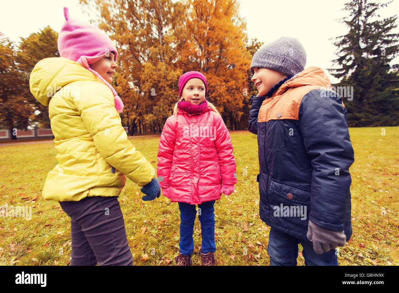group of happy children talking in autumn park Stock Photo - Alamy