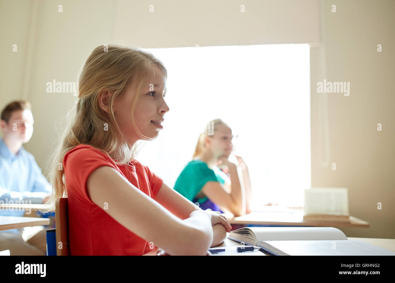 happy student girl at school lesson Stock Photo - Alamy