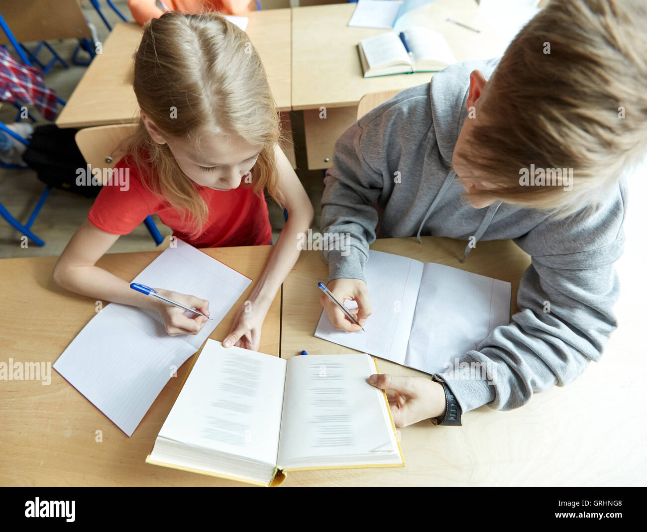high school students reading book and learning Stock Photo - Alamy