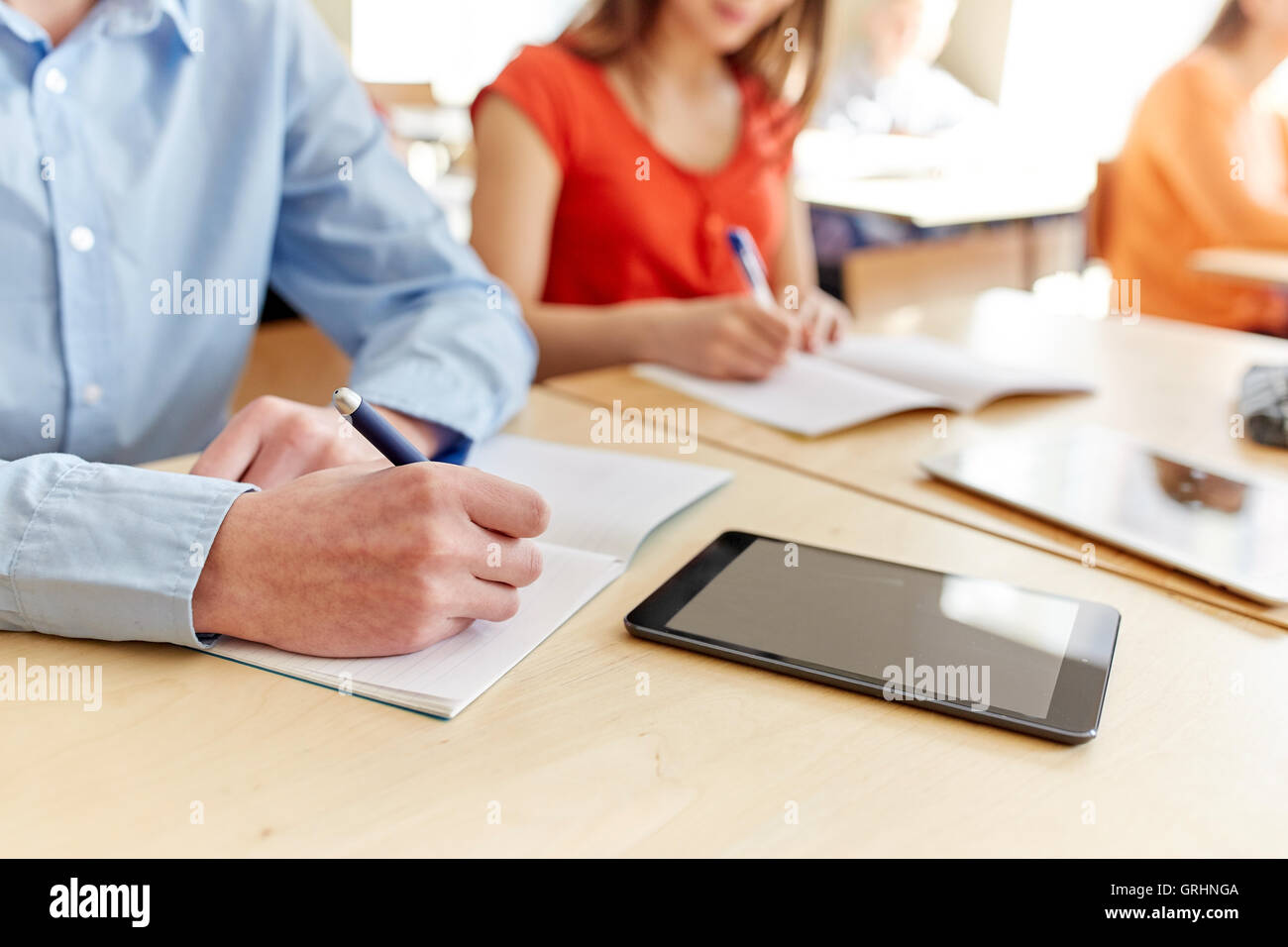 close up of students tablet pc writing at school Stock Photo - Alamy