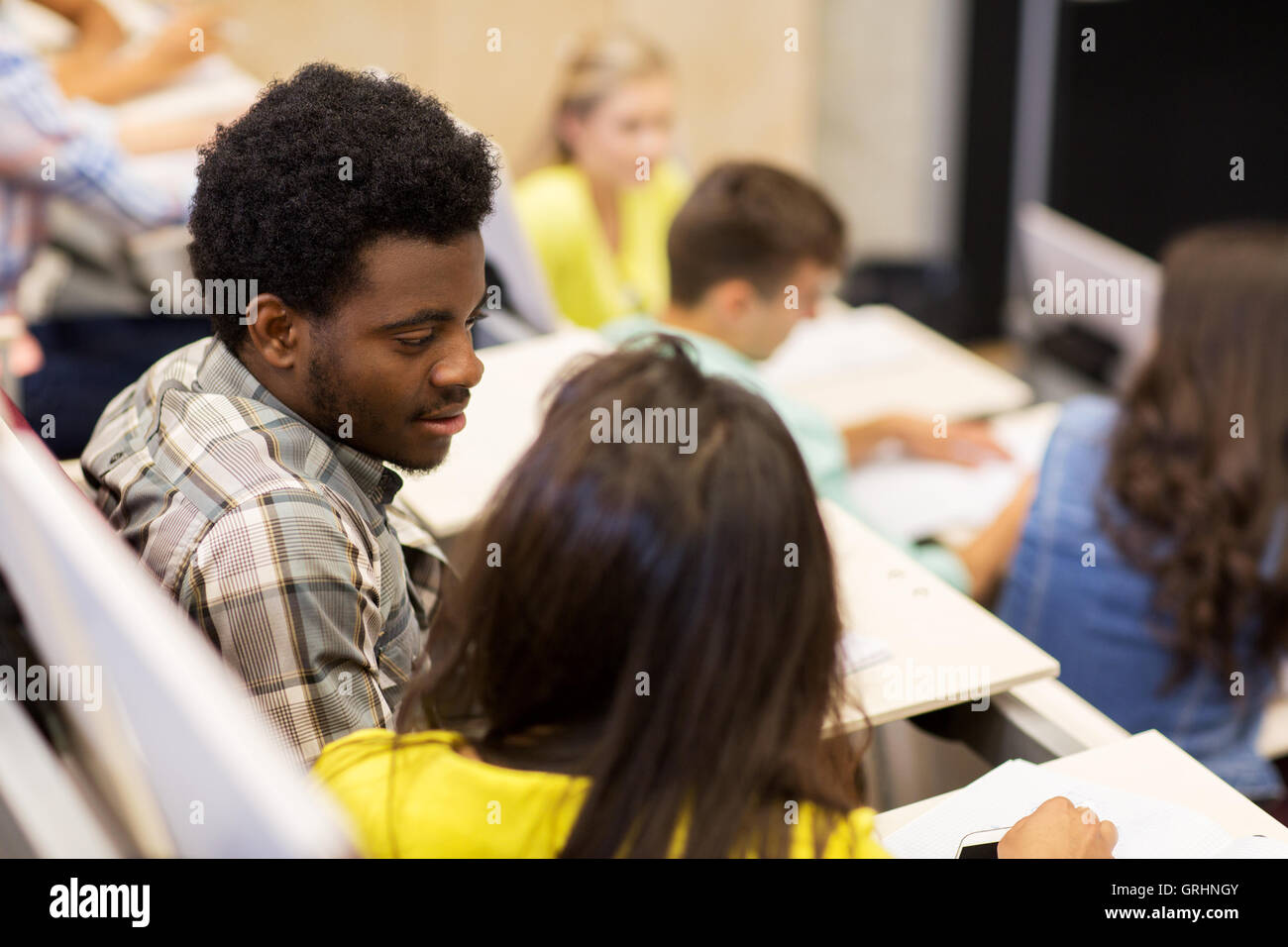 group of students talking in lecture hall Stock Photo - Alamy