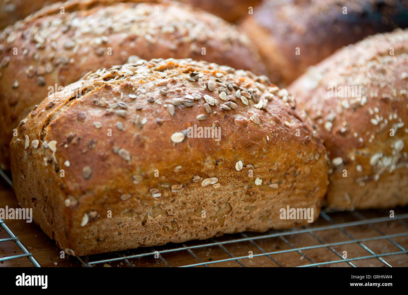 Freshly baked loaves of seeded bread Stock Photo - Alamy