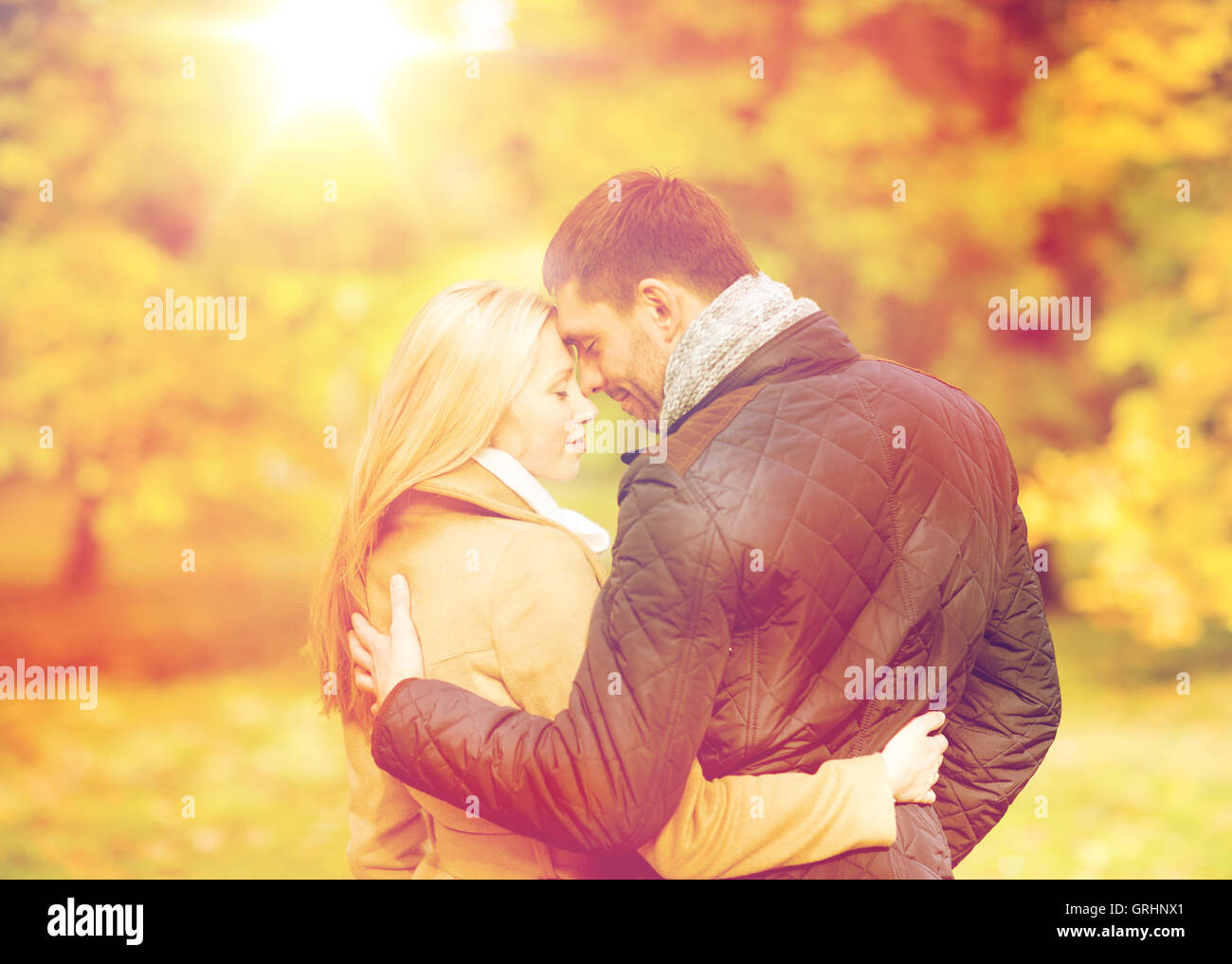 romantic couple kissing in the autumn park Stock Photo - Alamy