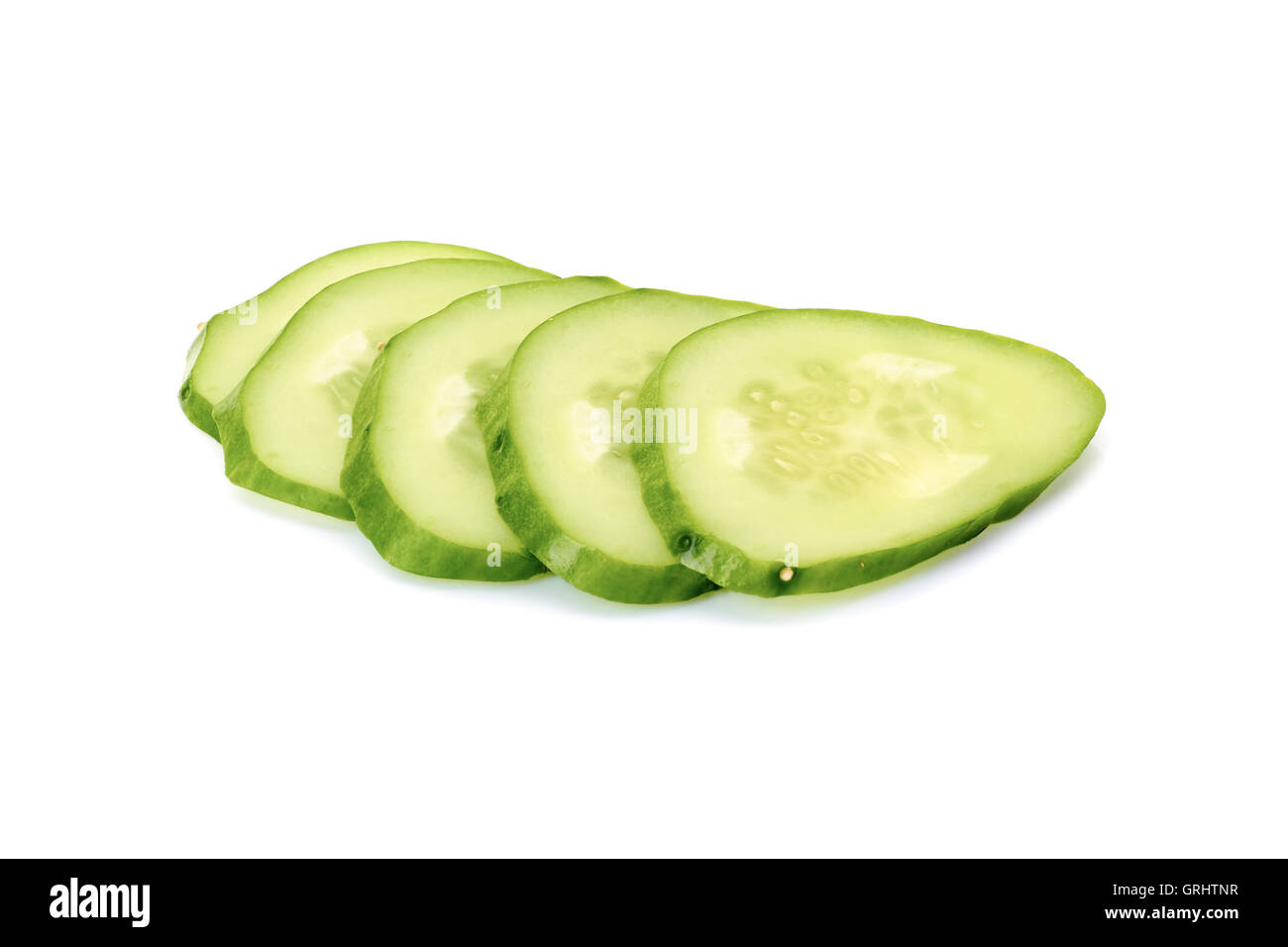 Cucumber pieces Cut Out Stock Images & Pictures - Alamy