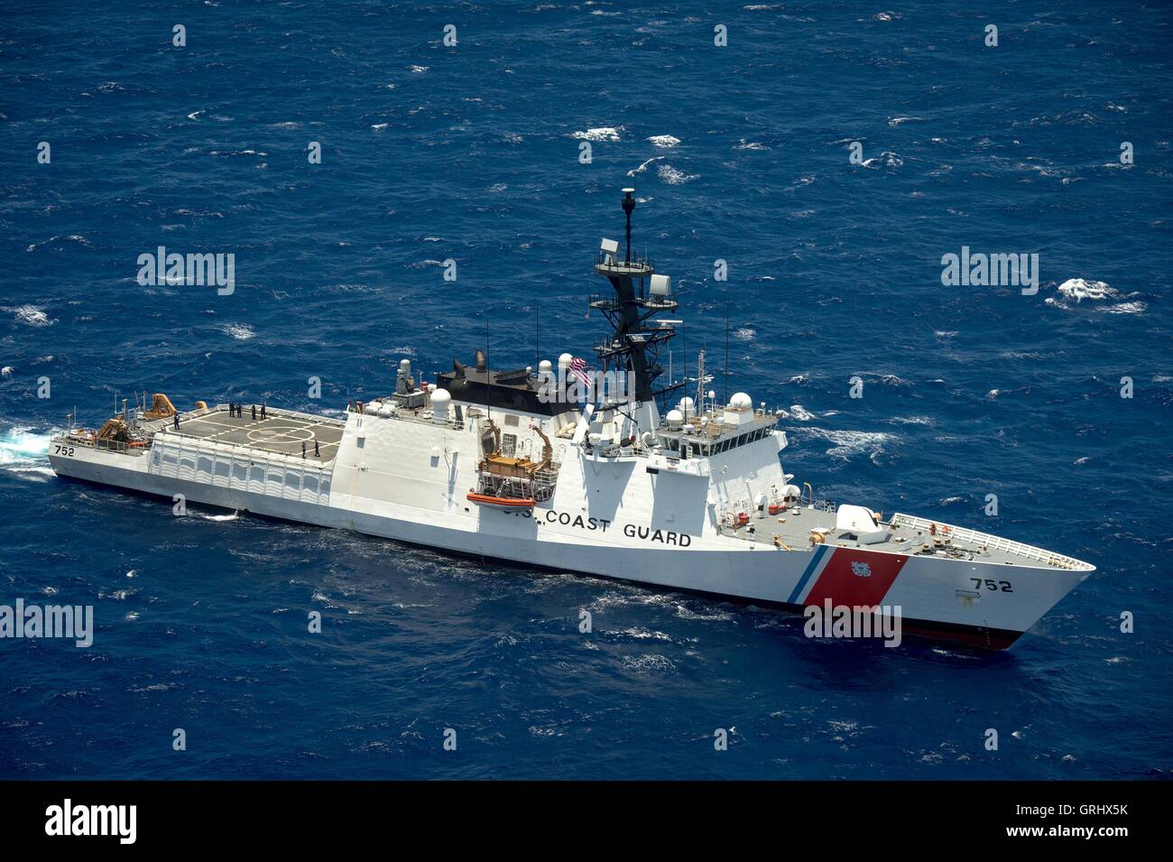 U.S. Coast Guard cutter USCG Stratton steams in close formation during ...
