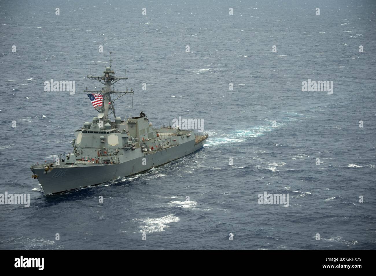 U.S. Navy guided-missile destroyer USS Stockdale steams in close ...