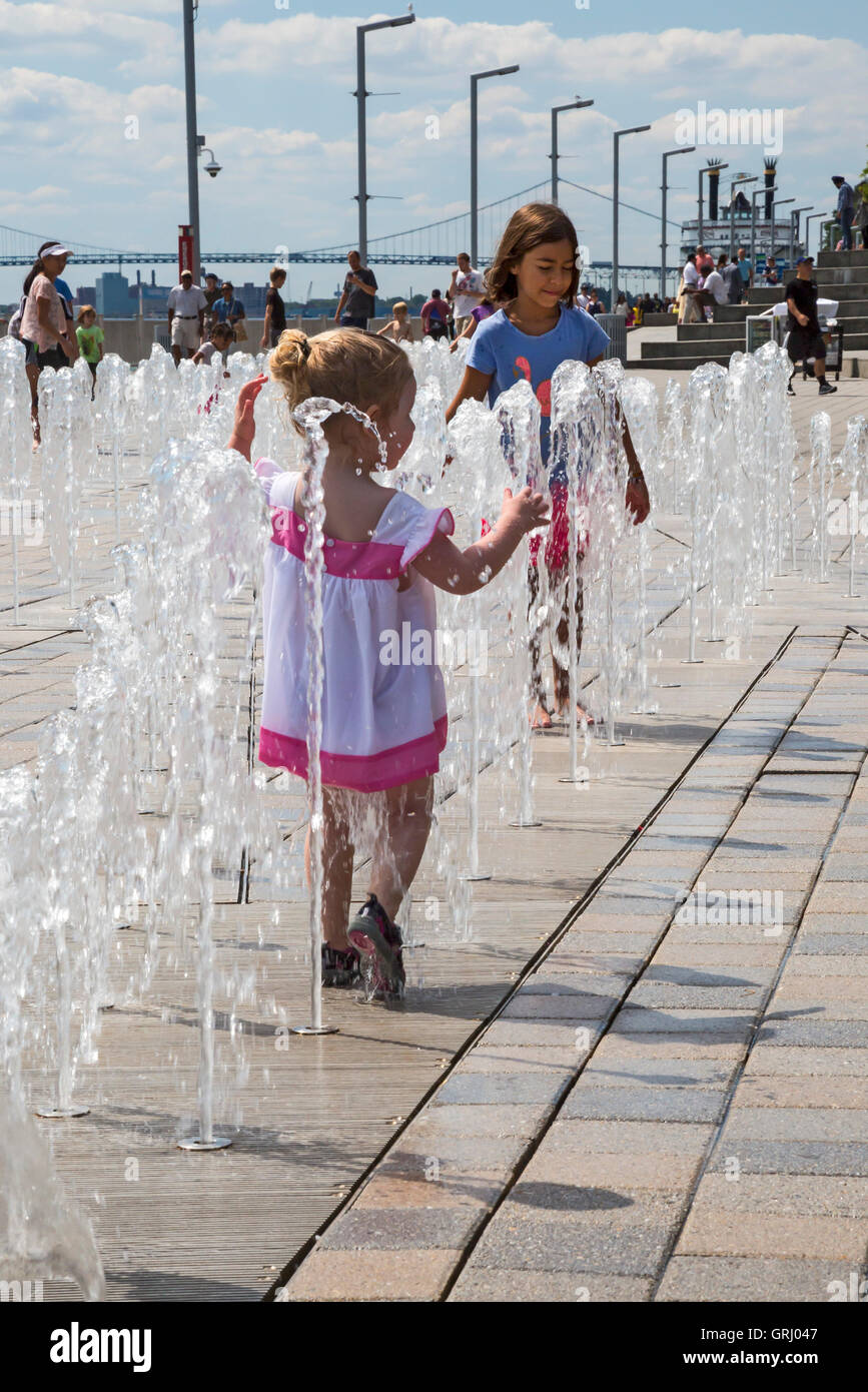 Detroit, Michigan - Children play in the fountains outside the General ...