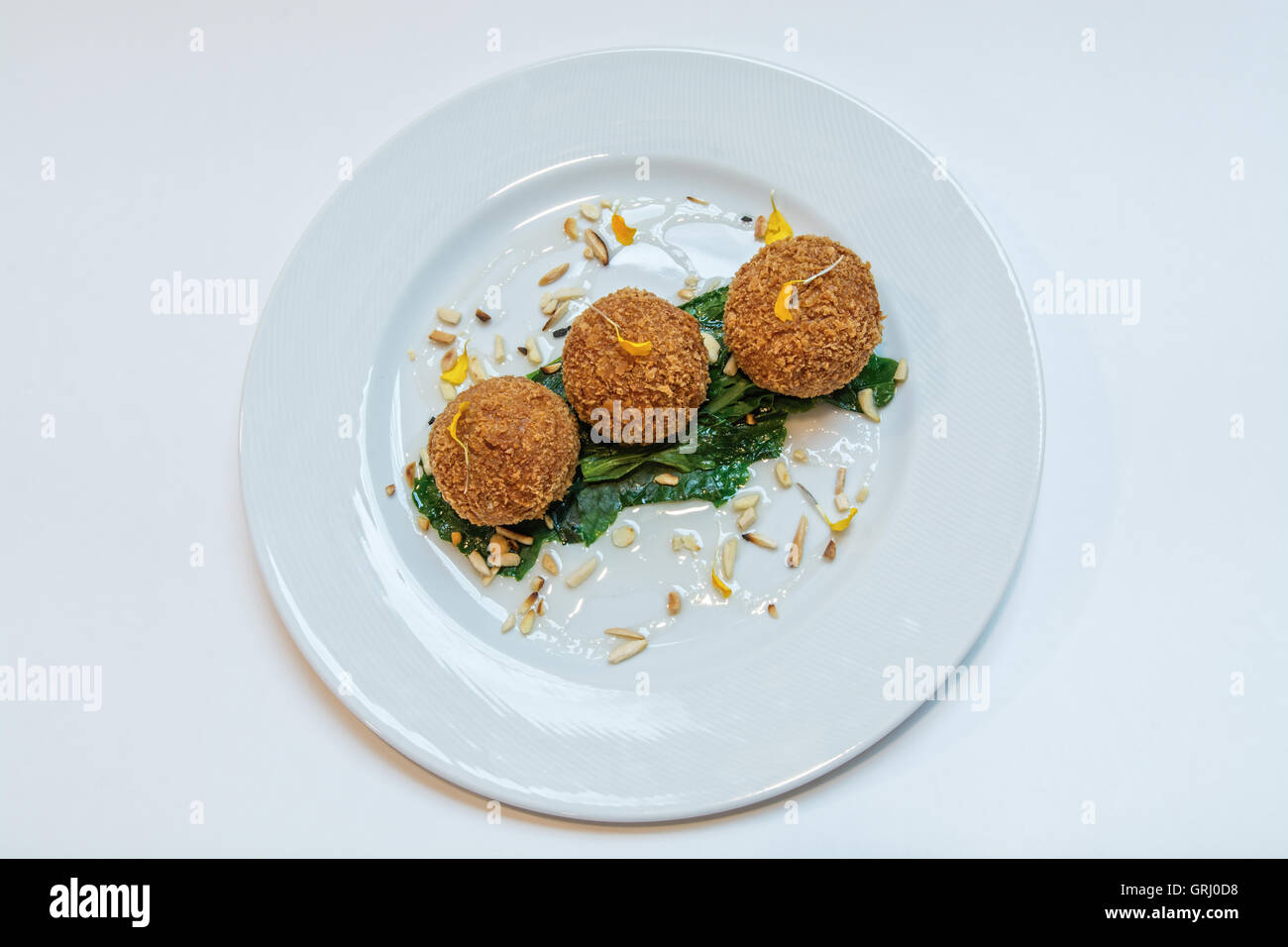 round meatballs fried circle meat balls on spinach leave Stock Photo ...