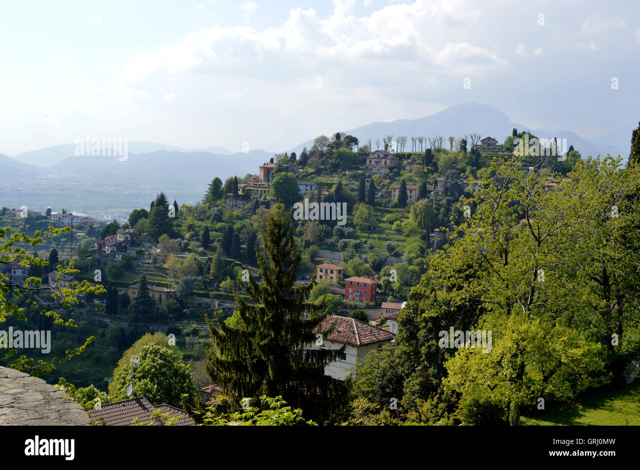 Sneak peek from the hills of Bergamo Italy Stock Photo - Alamy