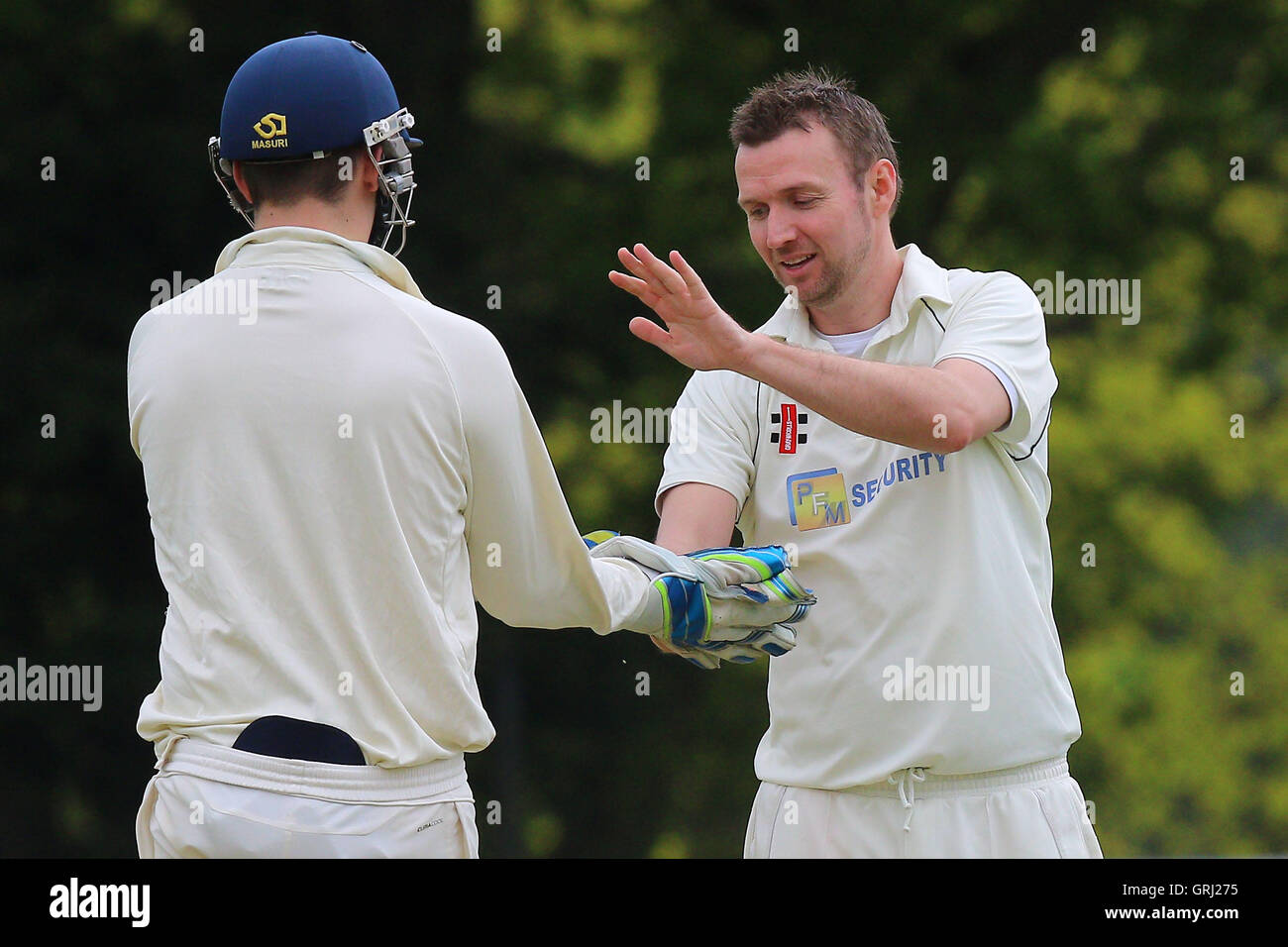 Michael Hindley of Shenfield celebrates a wicket during Wanstead and ...