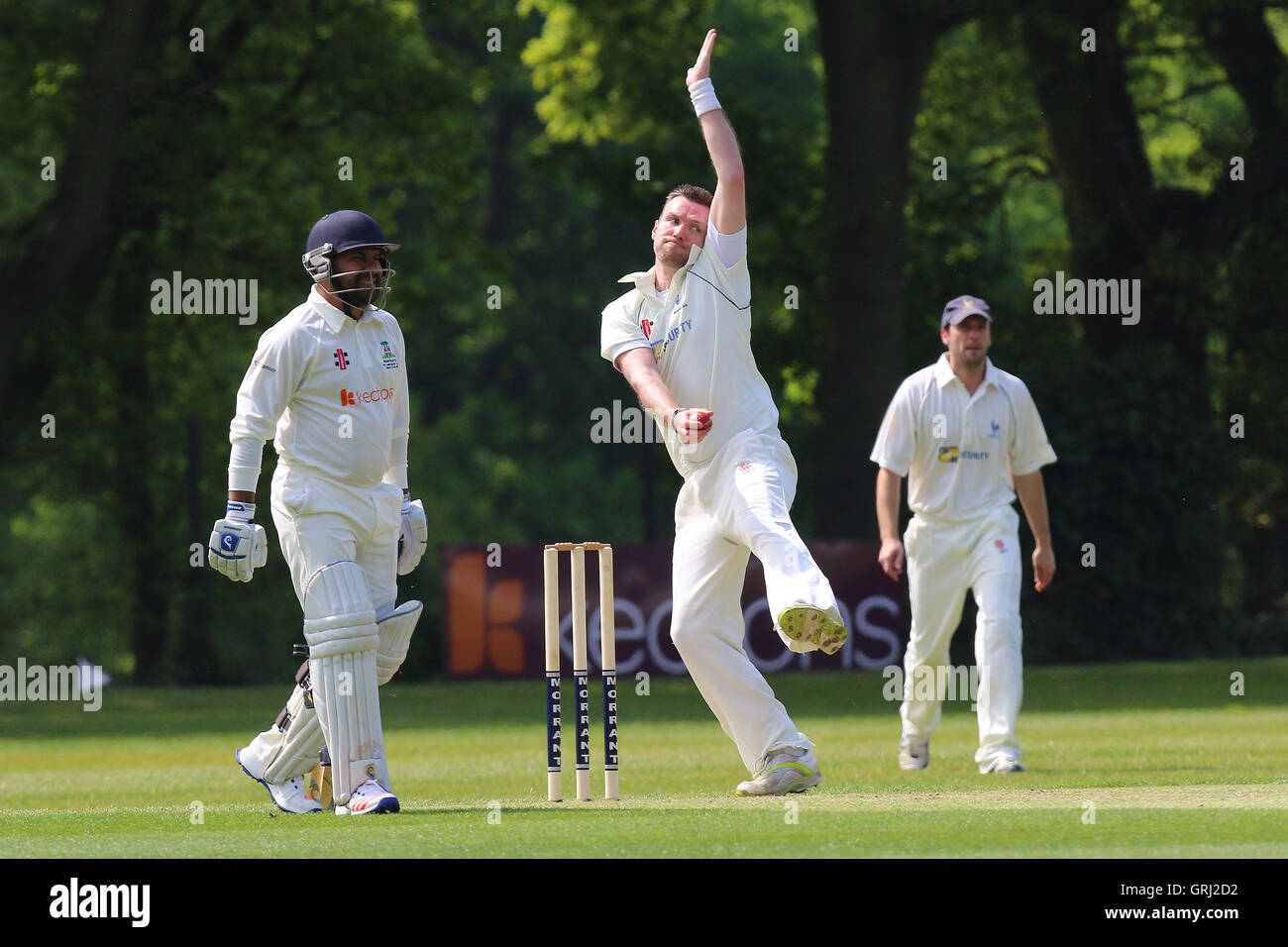 Michael Hindley in bowling action for Shenfield during Wanstead and ...