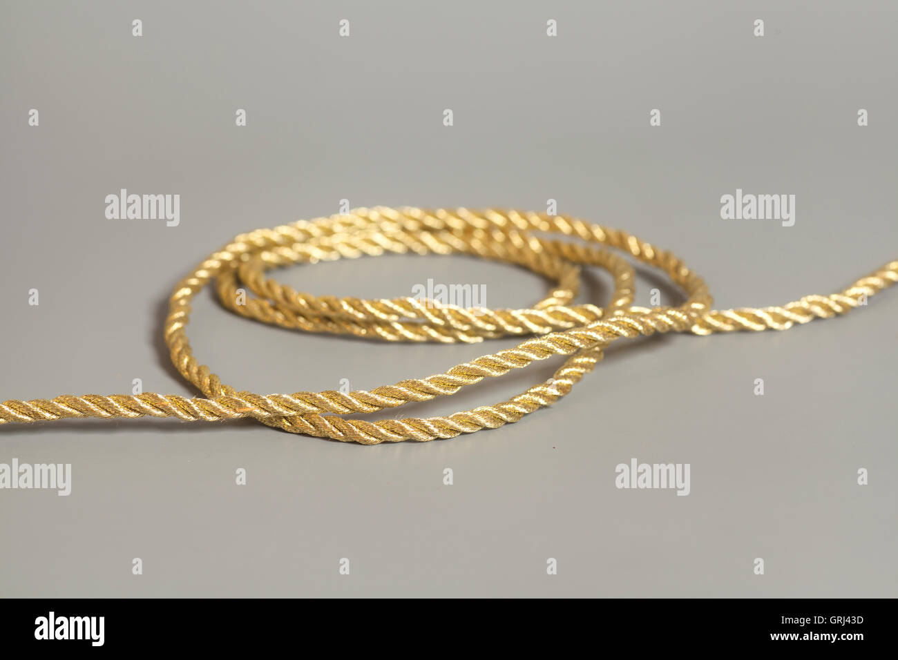 Tie gold cord hi-res stock photography and images - Alamy