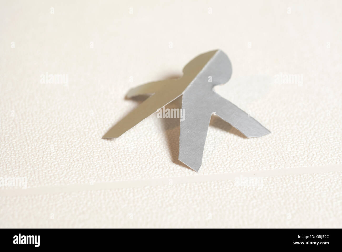 Folded Paper Men on white background Stock Photo - Alamy