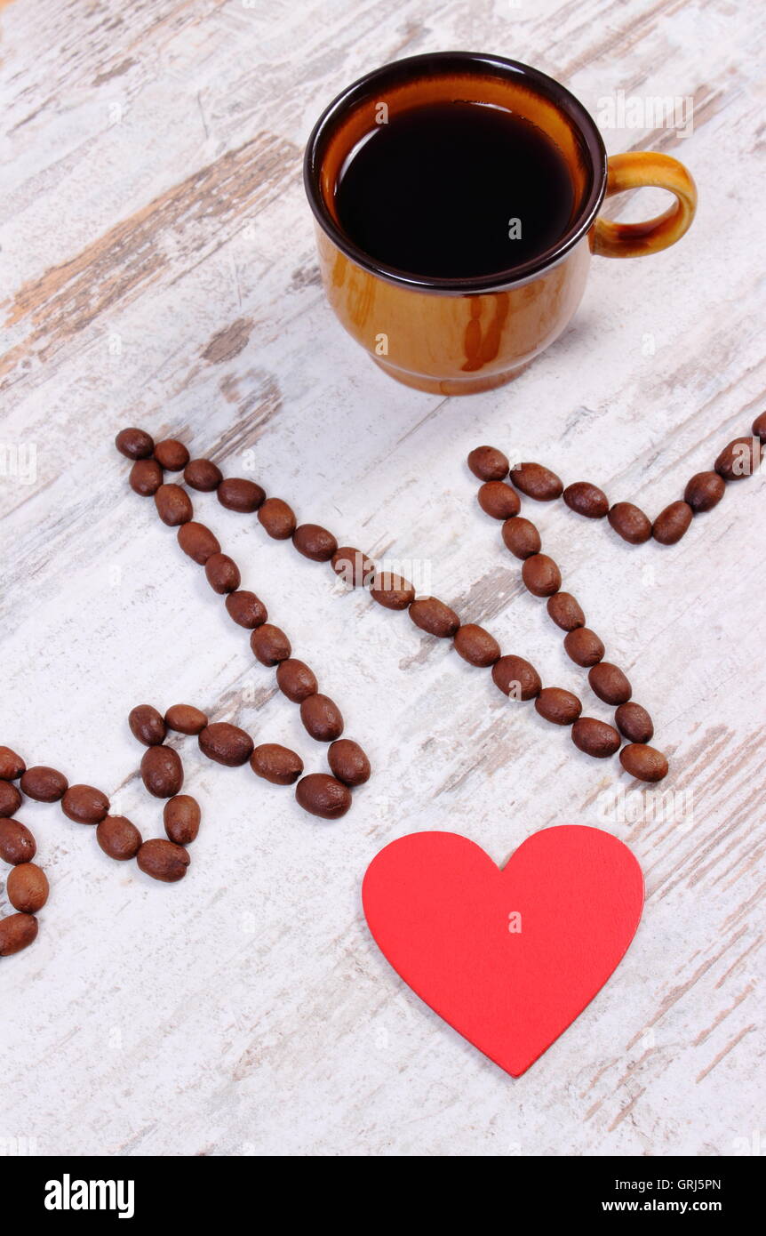 Electrocardiogram line of roasted coffee grains and cup of hot coffee ...