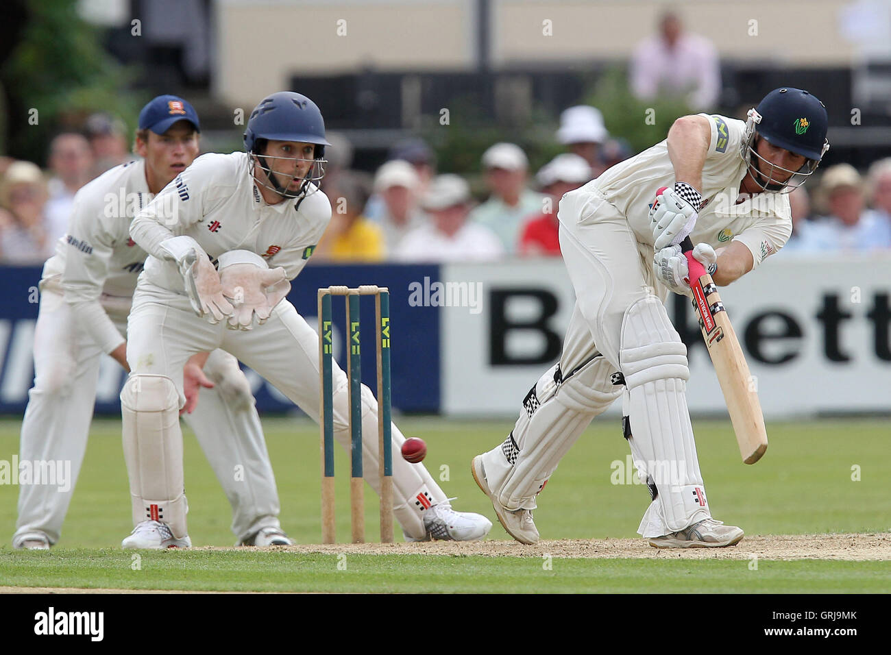 Mark Wallace in batting action for Glamorgan as James Foster looks on ...