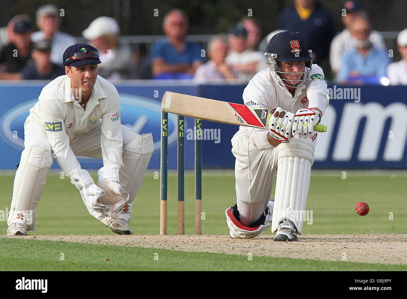 Tom Westley sweeps the ball for Essex as Mark Wallace looks on - Essex ...