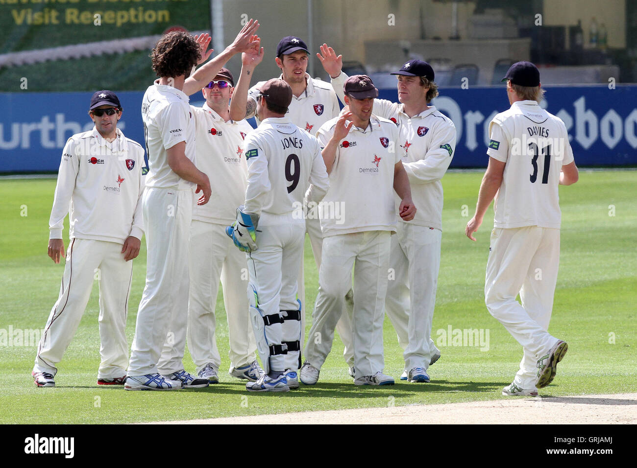 Charlie Shreck of Kent (arm raised) celebrates the wicket of Greg Smith ...