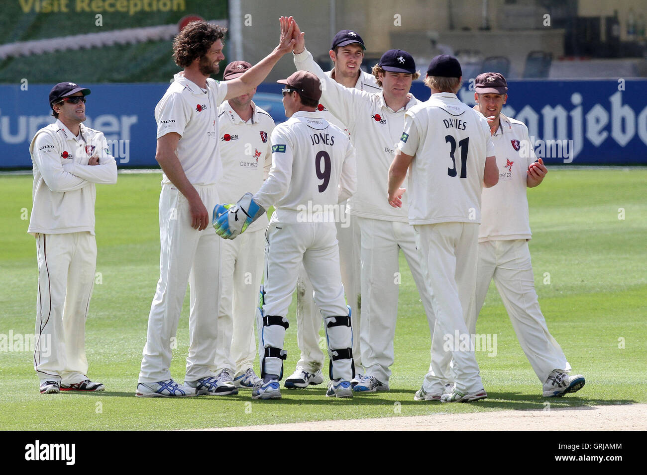 Charlie Shreck of Kent (arm raised) celebrates the wicket of Greg Smith ...