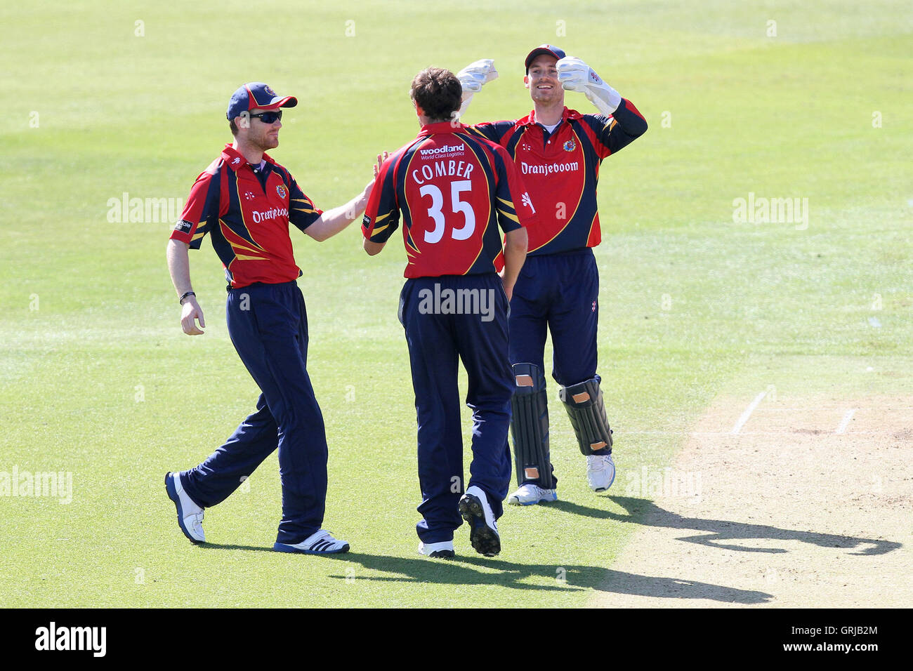 Michael Comber of Essex celebrates the wicket of Sam Robson with his ...