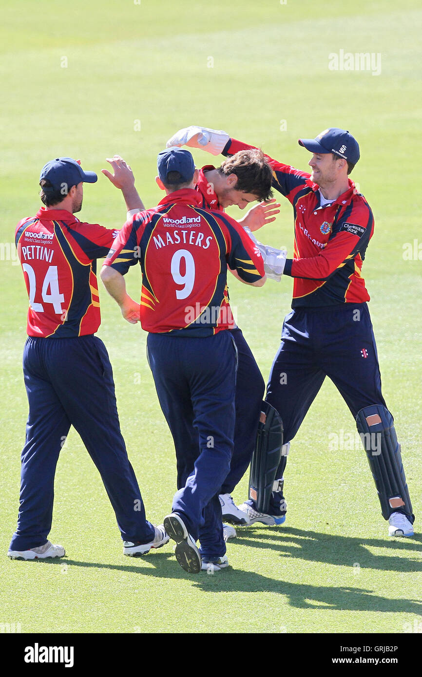 Michael Comber of Essex celebrates the wicket of Sam Robson with his ...