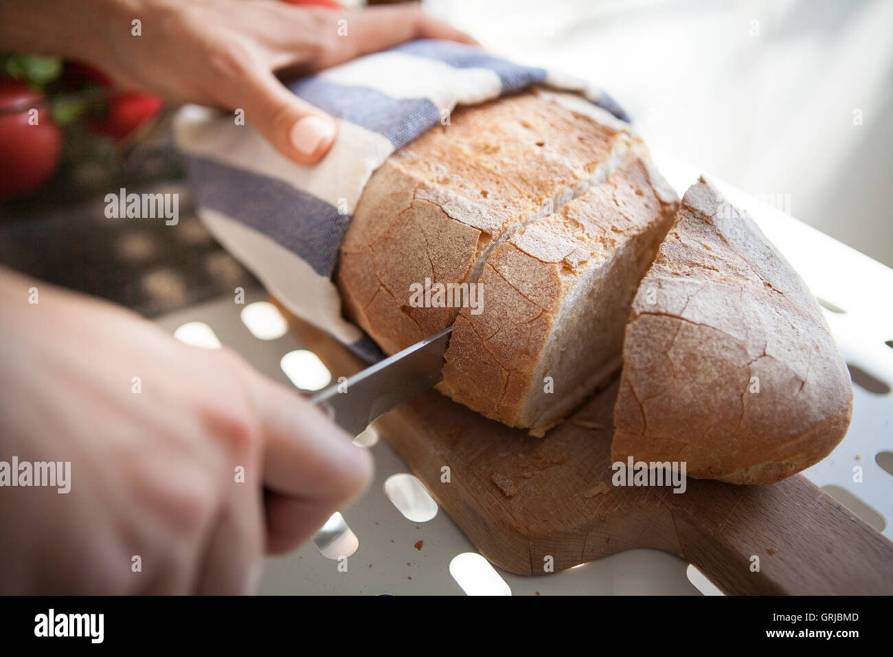 Wood cutting board bread knife slice of bread hi-res stock photography ...