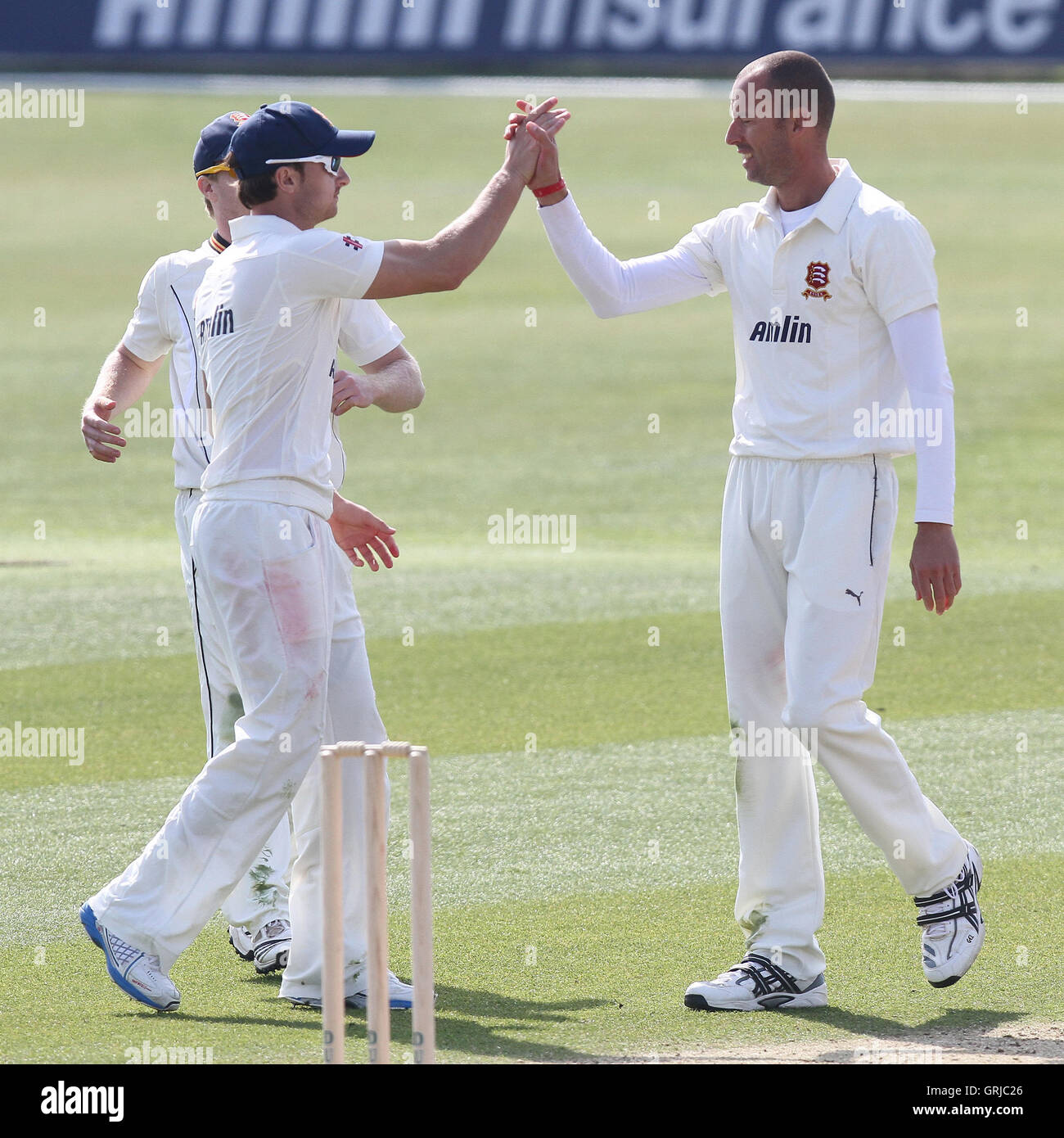 Charl Willoughby of Essex (R) celebrates the wicket of James Cameron ...