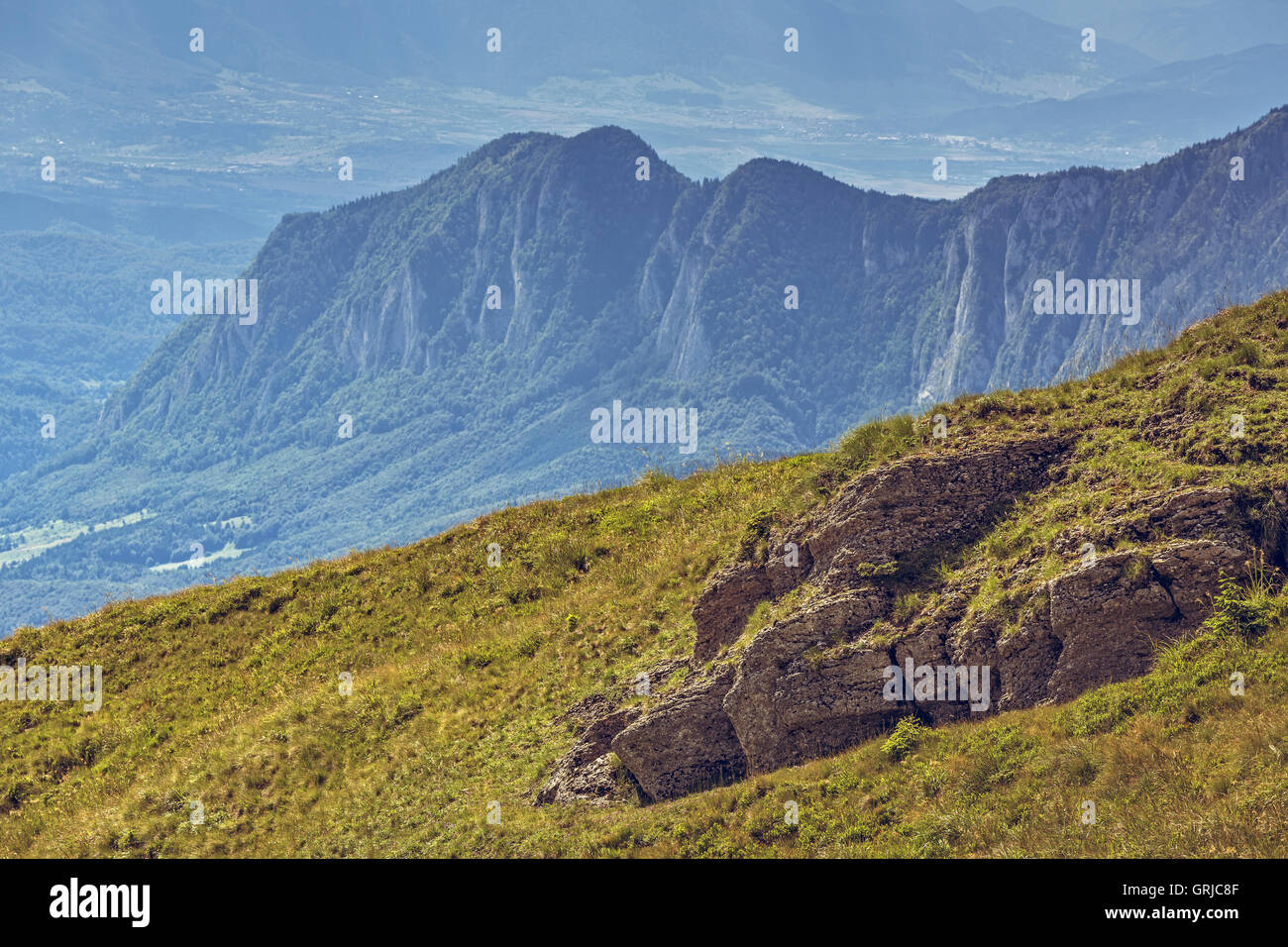 Beautiful alpine scenery with Postavaru Mountain range in the distance ...