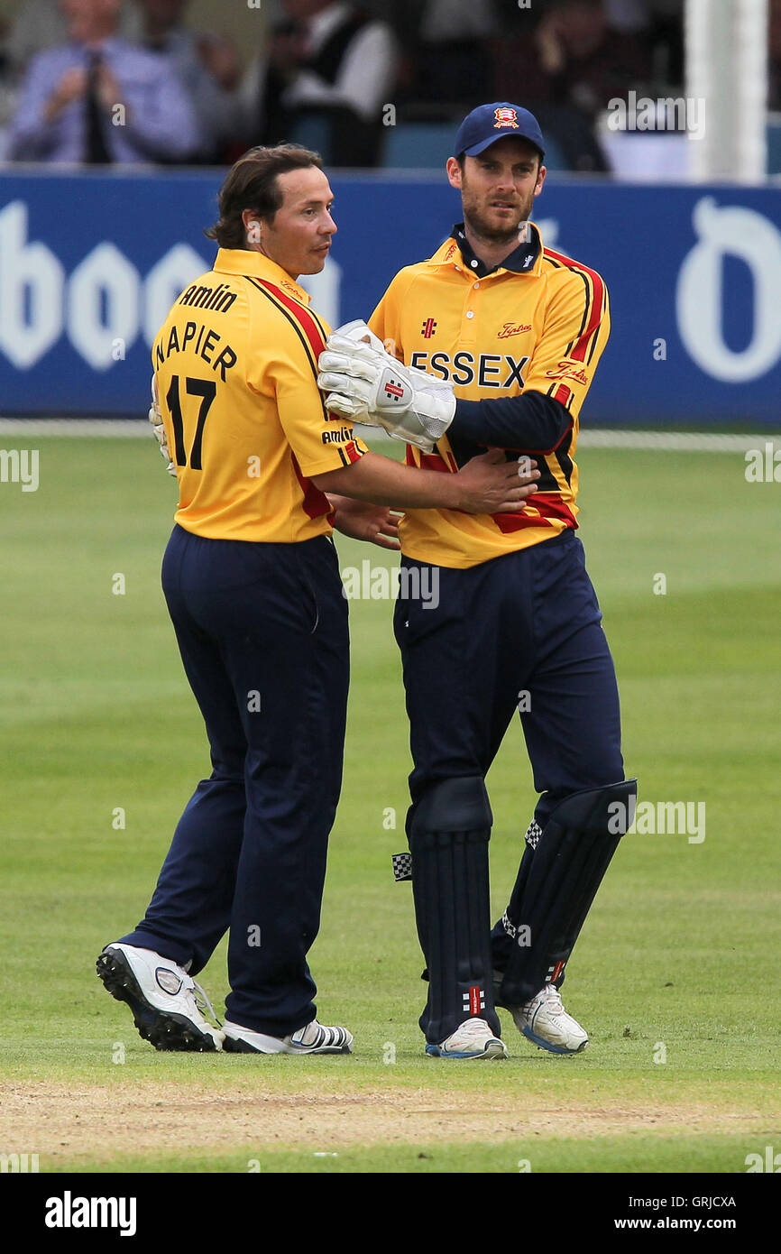 James Foster of Essex (R) congratulates Graham Napier on the wicket of ...