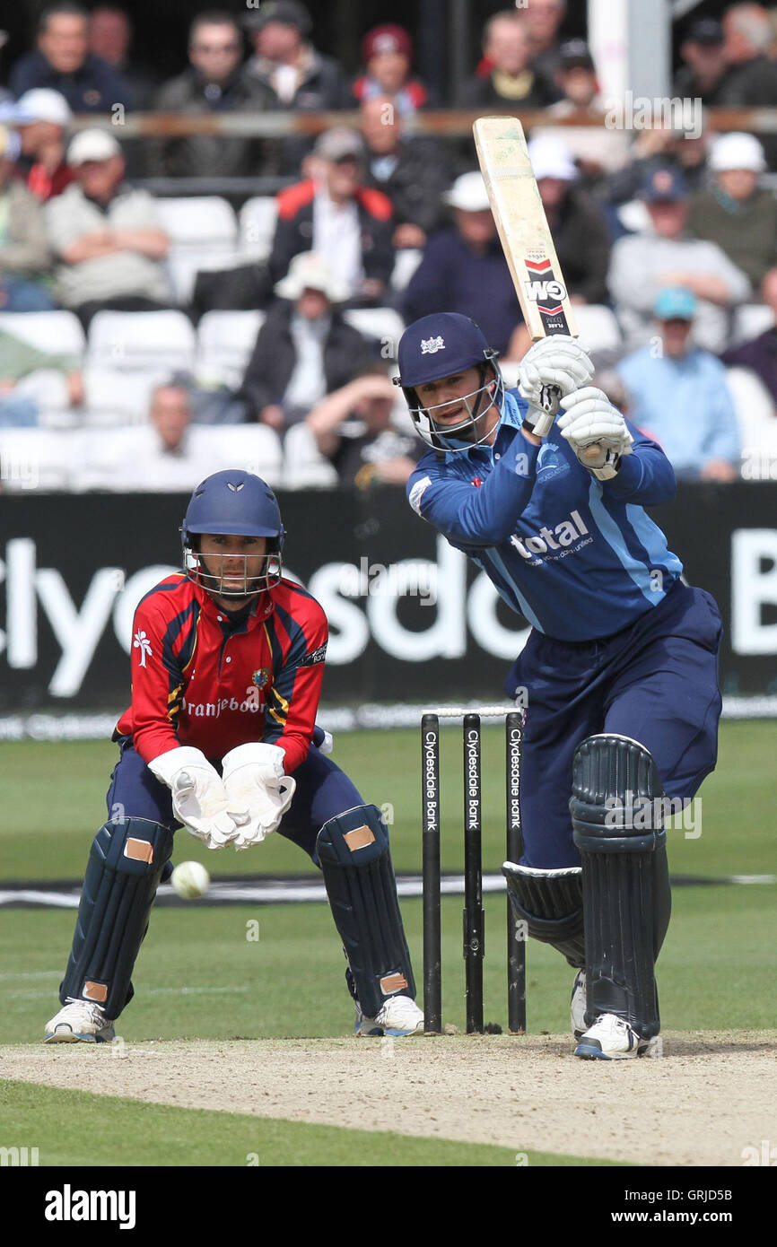Alex Gidman in batting action for Gloucestershire as James Foster looks ...