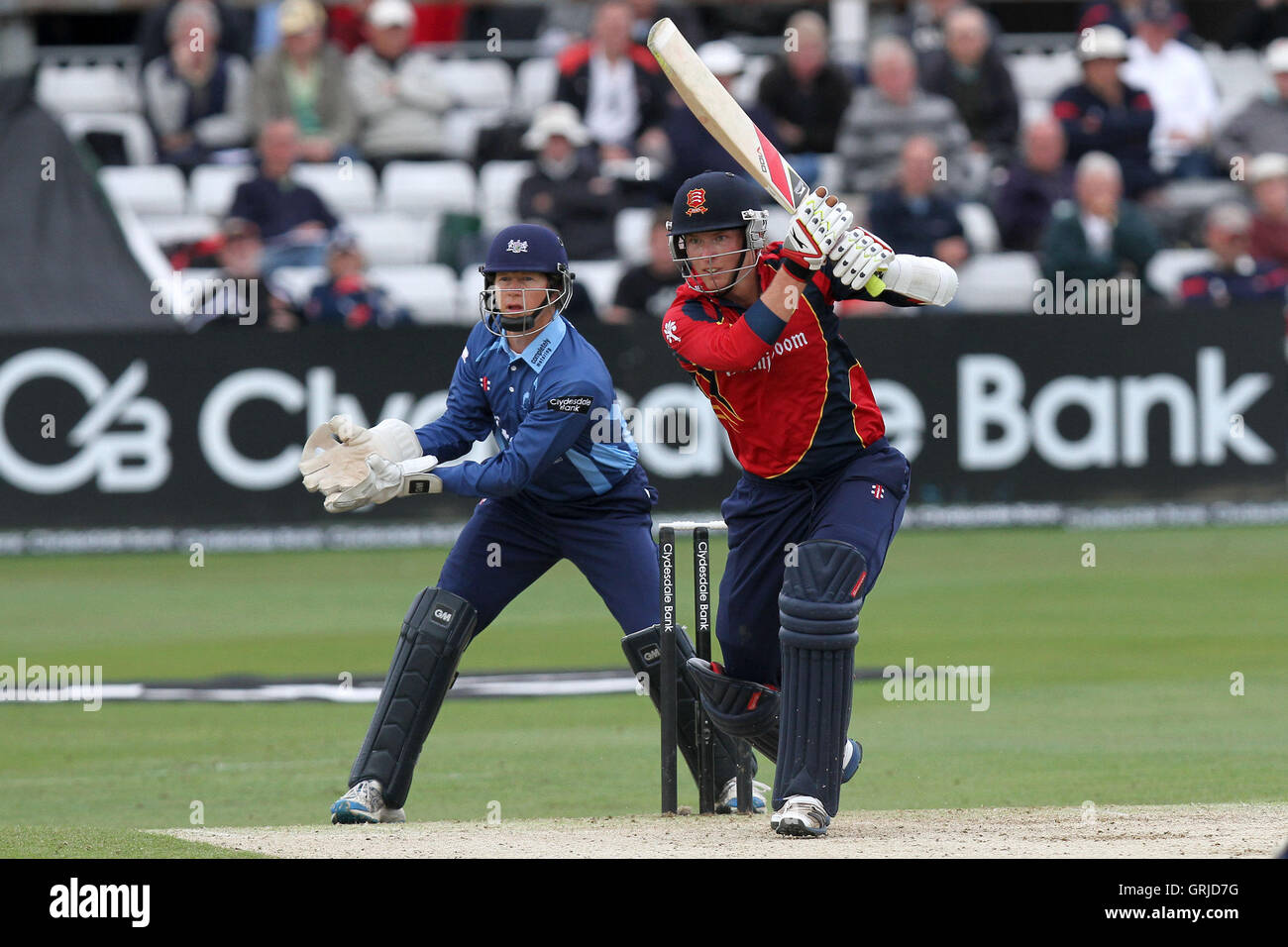 Tom Westley drives four runs for Essex as Jonathan Batty looks on ...