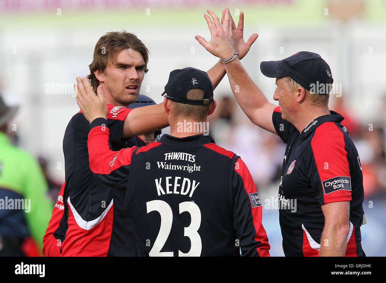 Oliver Newby of Lancashire (L) celebrates the wicket of Tom Westley ...