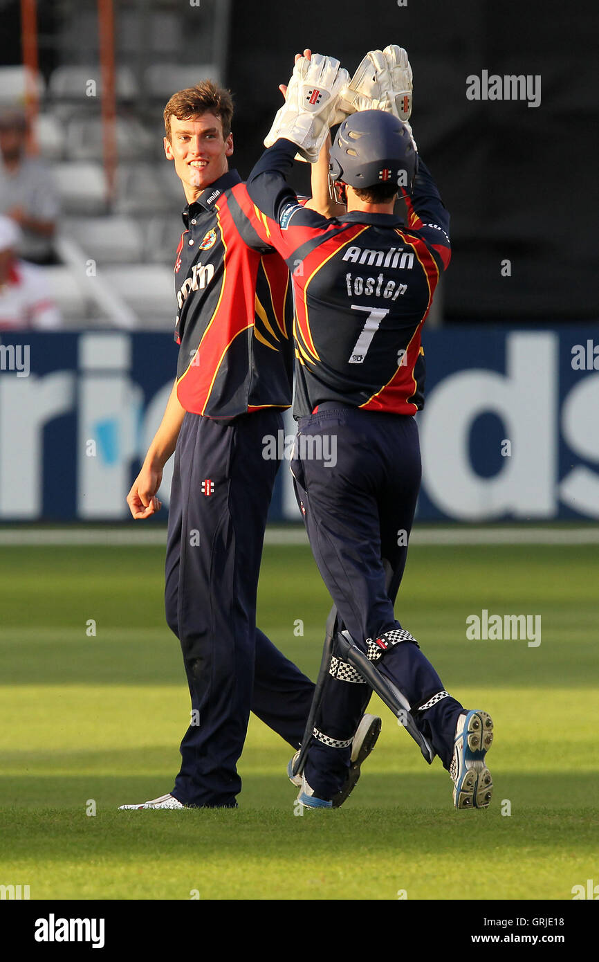 Reece Topley of Essex celebrates the wicket of Joe Denly with James ...