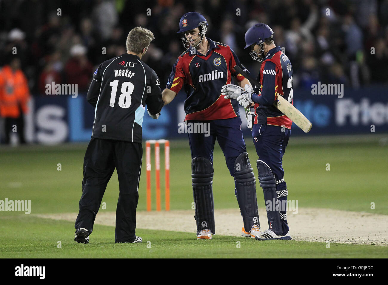 Stuart Meaker of Surrey congratulates James Franklin (C) and Tim ...